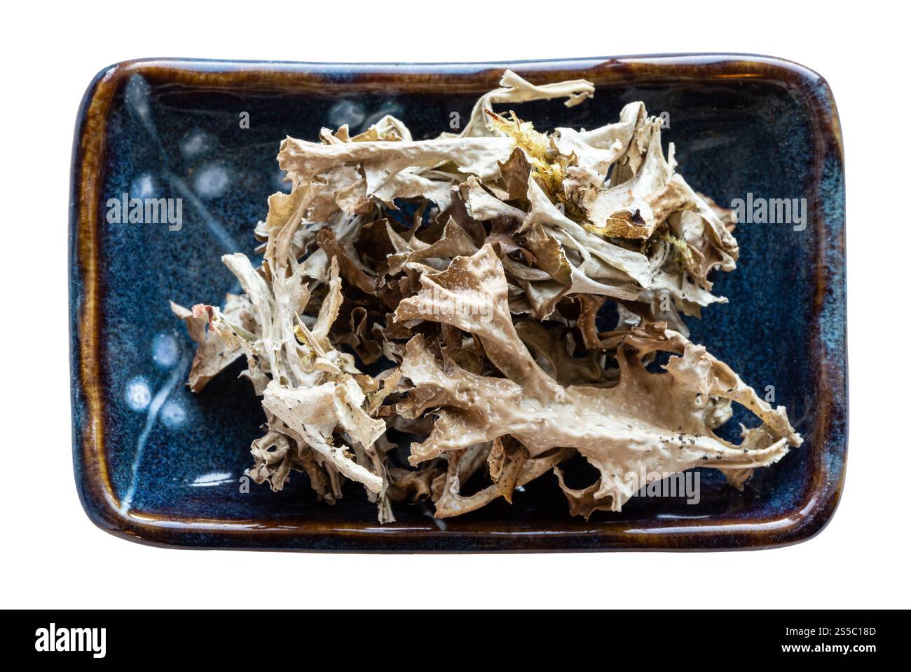 portion of dried Iceland moss (Cetraria islandica) in bowl isolated on ...