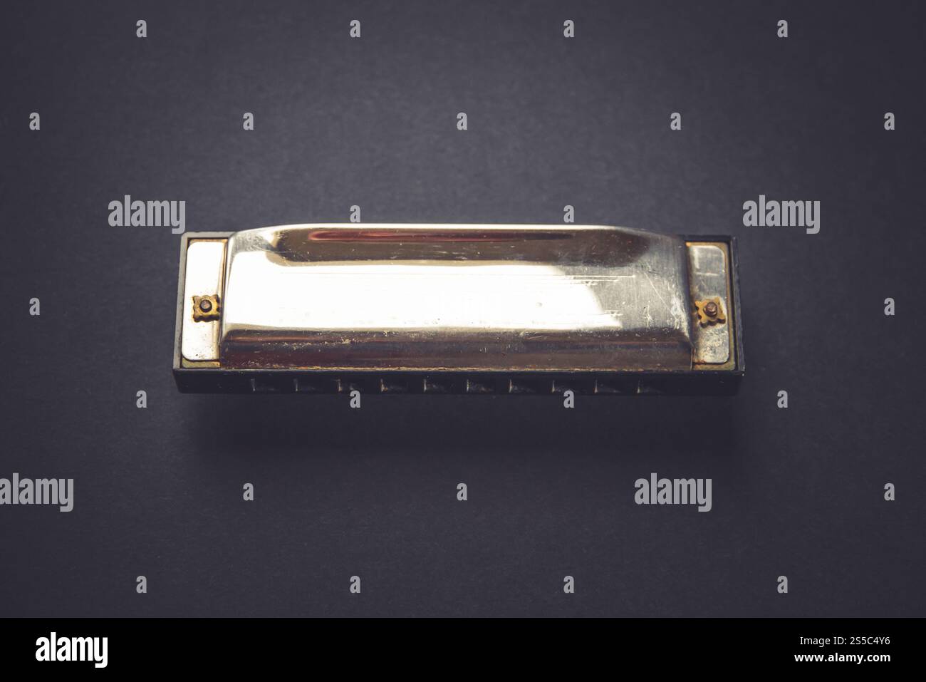 Vintage harmonica isolated on a black background. Vintage harmonica ...