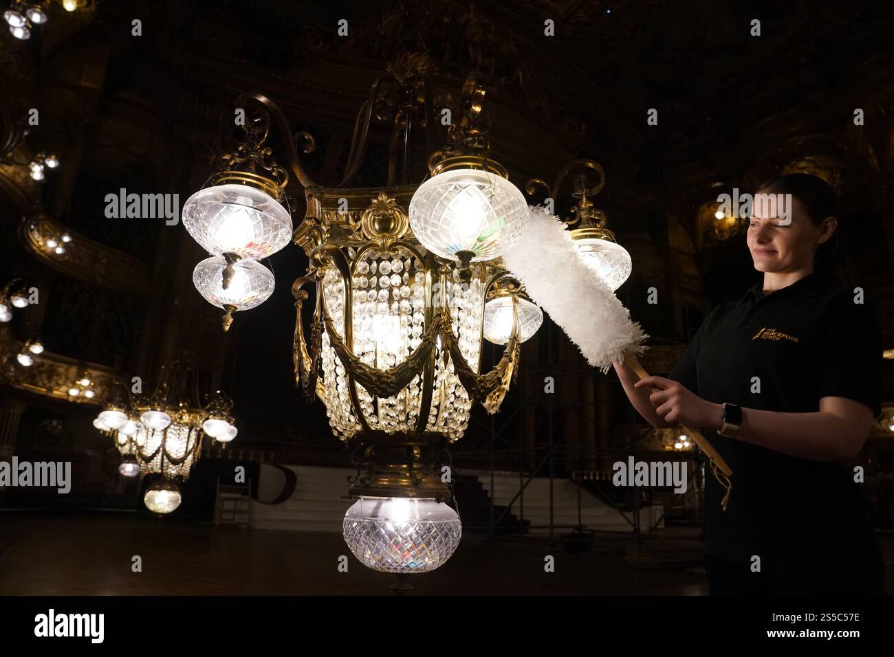 Tower ballroom team member Jennifer Allinson cleans one of the twelve ...