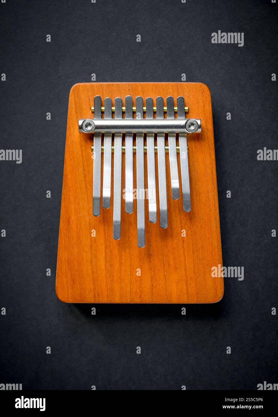 Traditional wooden kalimba isolated on black background. Traditional ...