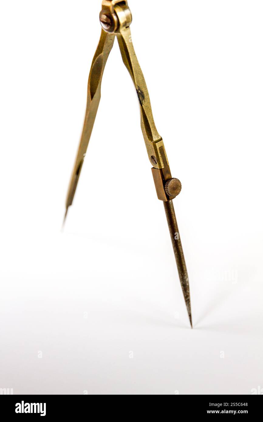 Old vintage pair of compasses isolated on a white background. Old ...