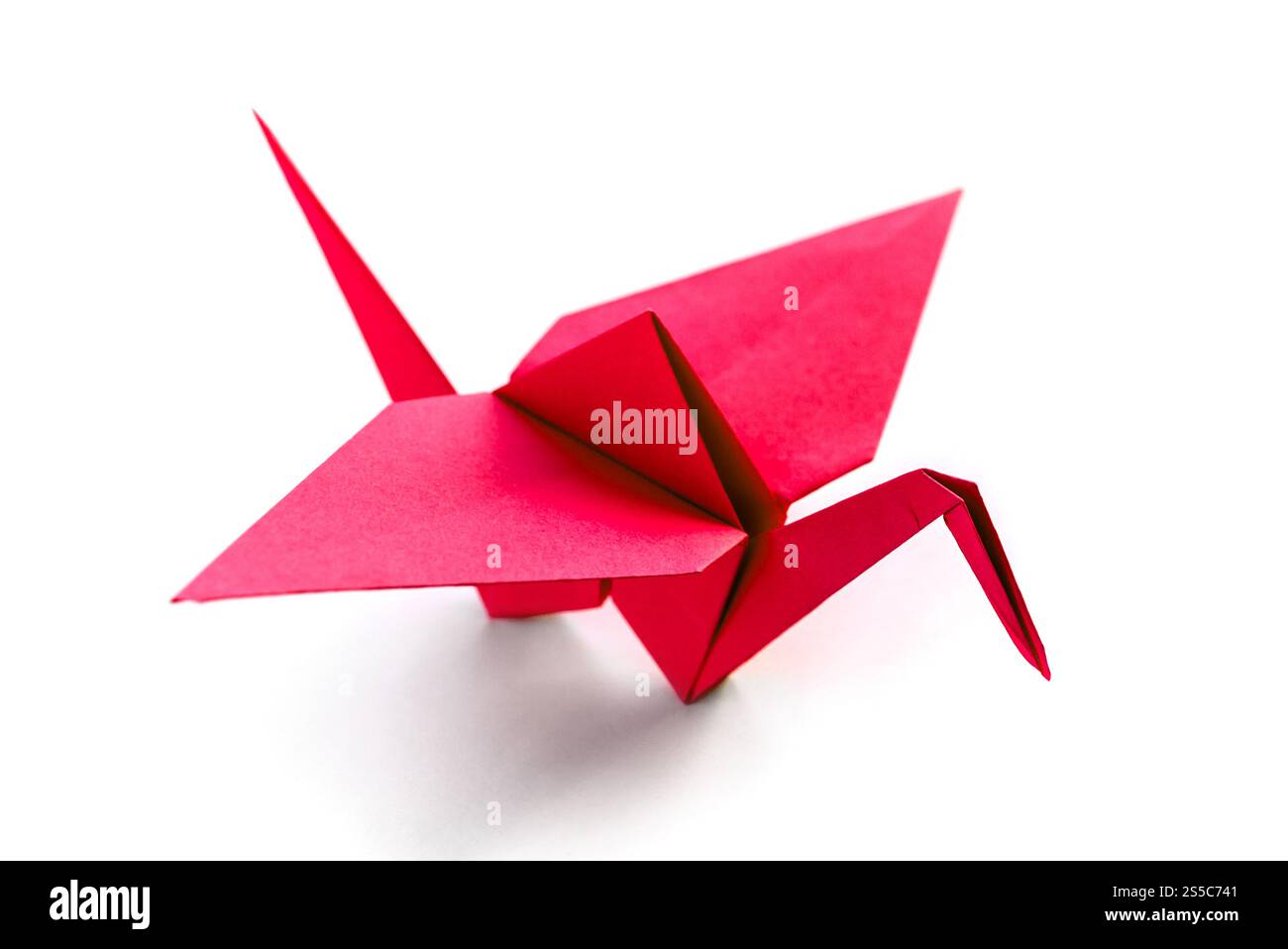 Red paper crane origami isolated on a blank white background. Red paper ...