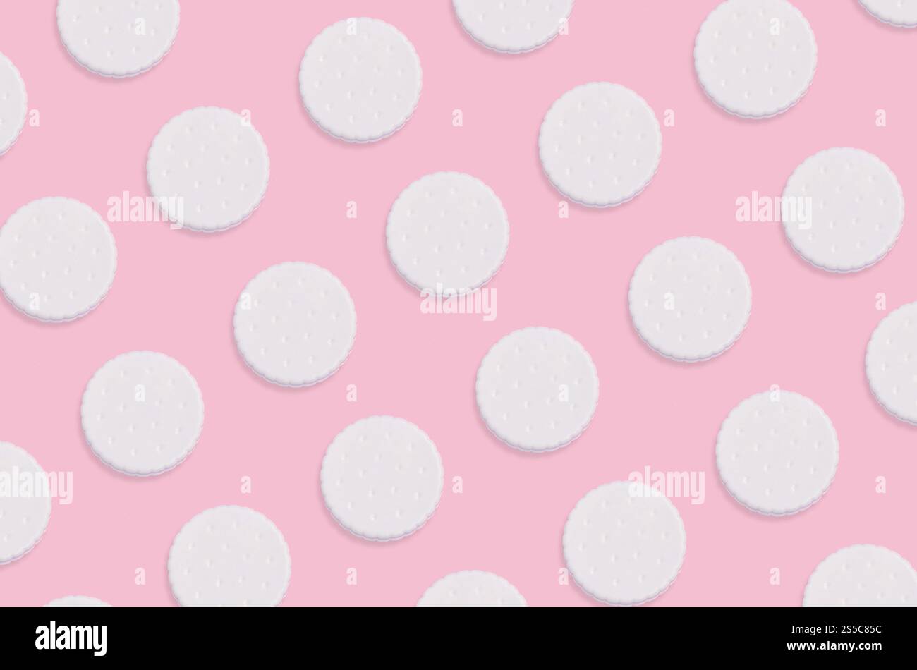 Creative art made with cookies pattern on pastel pink background ...