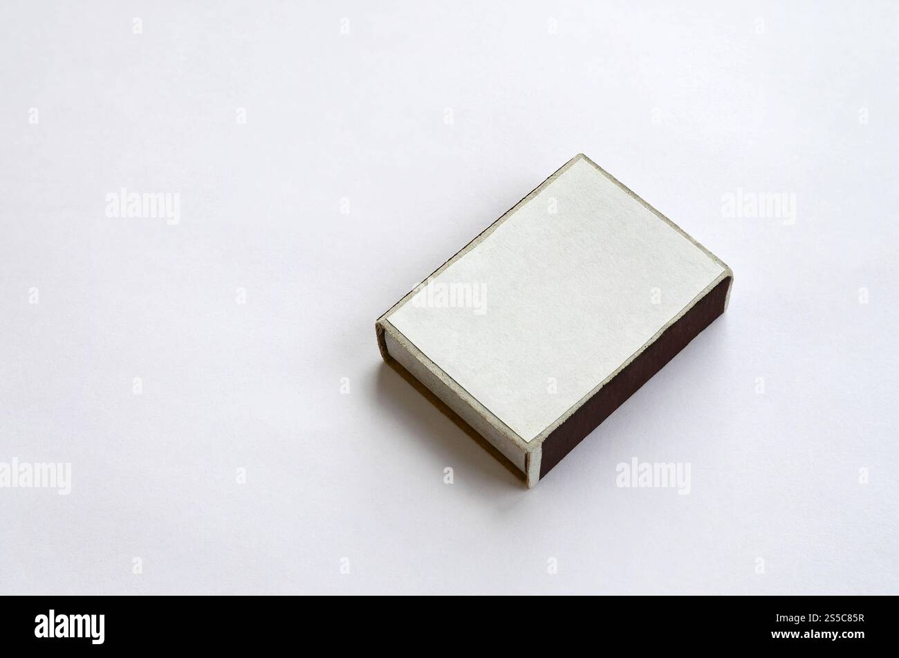 Closed cardboard matchbox on a white background. Flat lay minimal. Top ...
