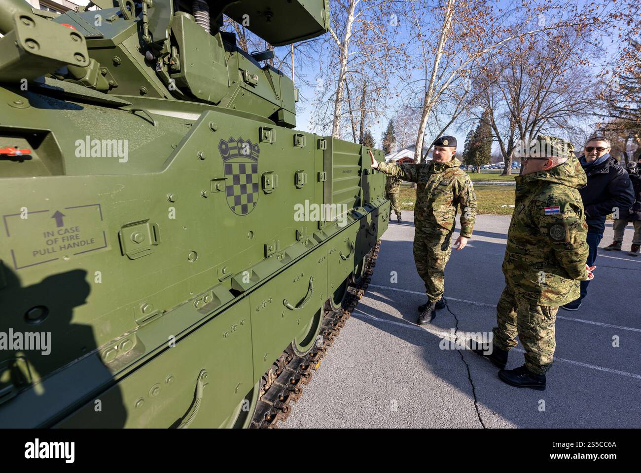 Nasice, Croatia. 14th Jan, 2025. Croatian soldiers looks at the Bradley ...