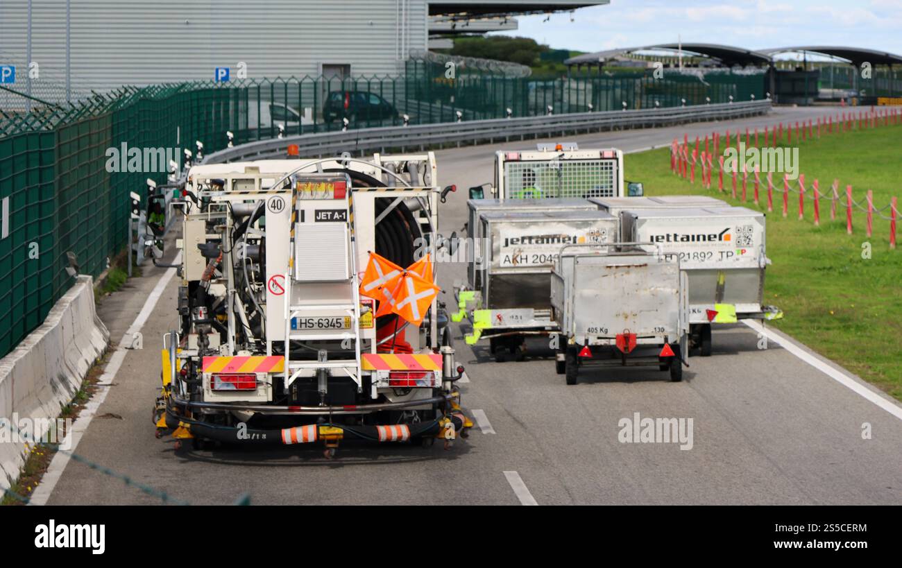 Ground support equipment parked near the runway at lisbon humberto ...