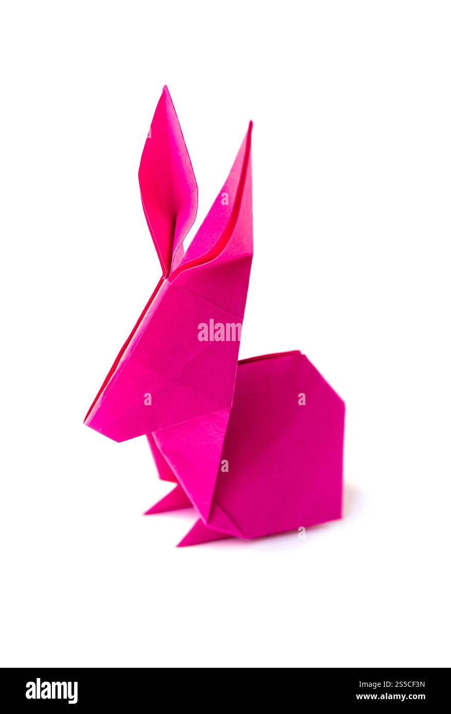 Pink paper rabbit origami isolated on a blank white background. Pink ...