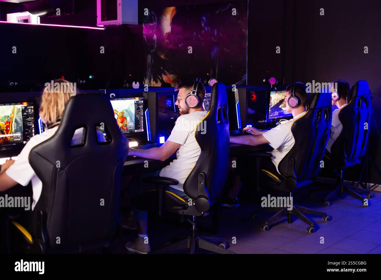 Five Caucasian gamers of different ages are playing strategy game in ...