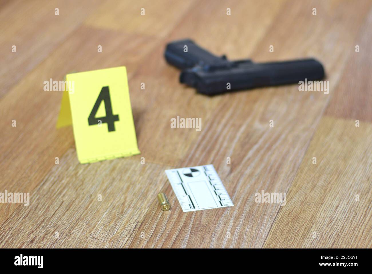 Crime scene investigation concept - Pistol and bullet shell against the ...