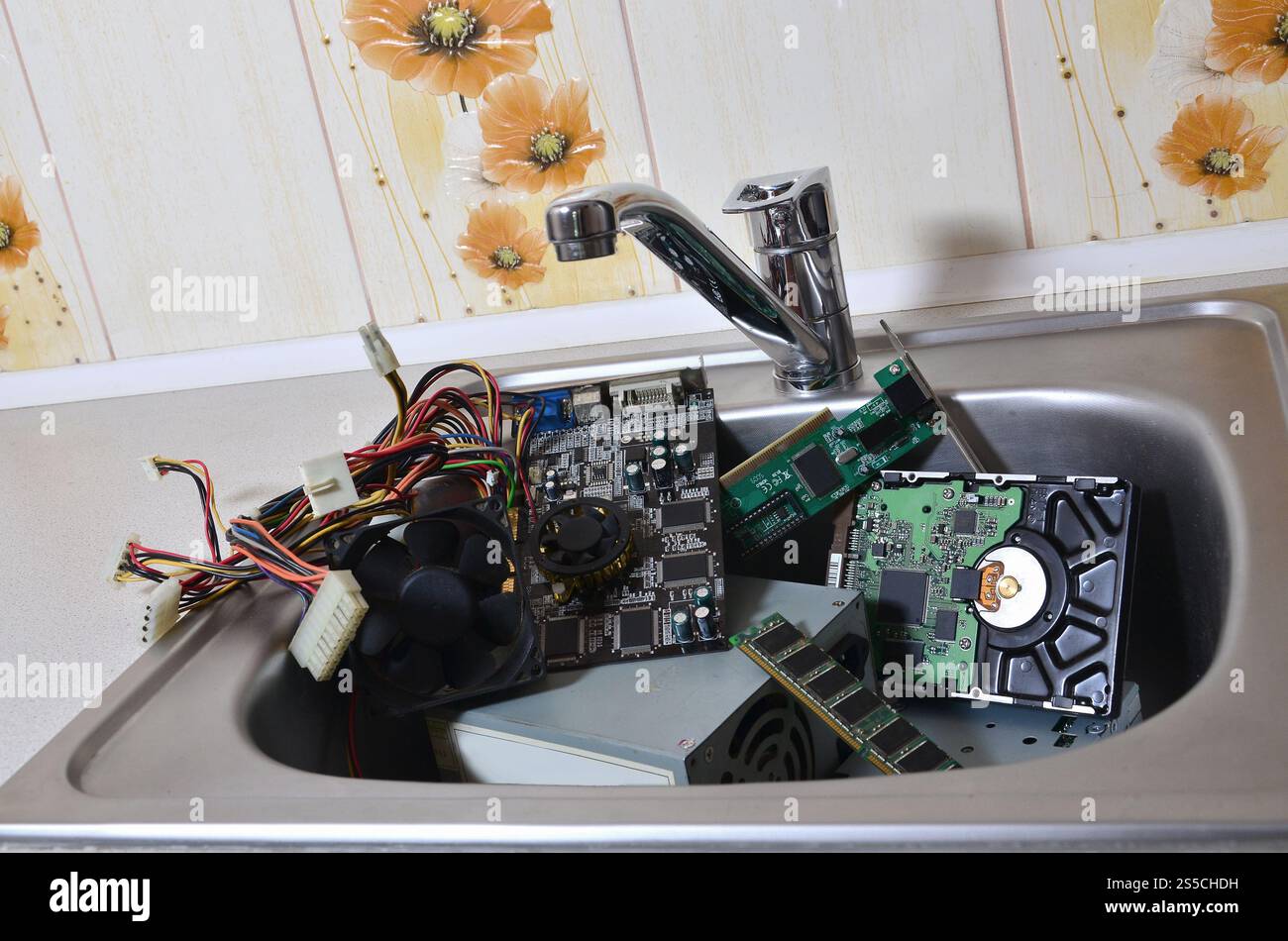 Personal computer cleaning metaphoric concept. Hardware in kitchen sink ...