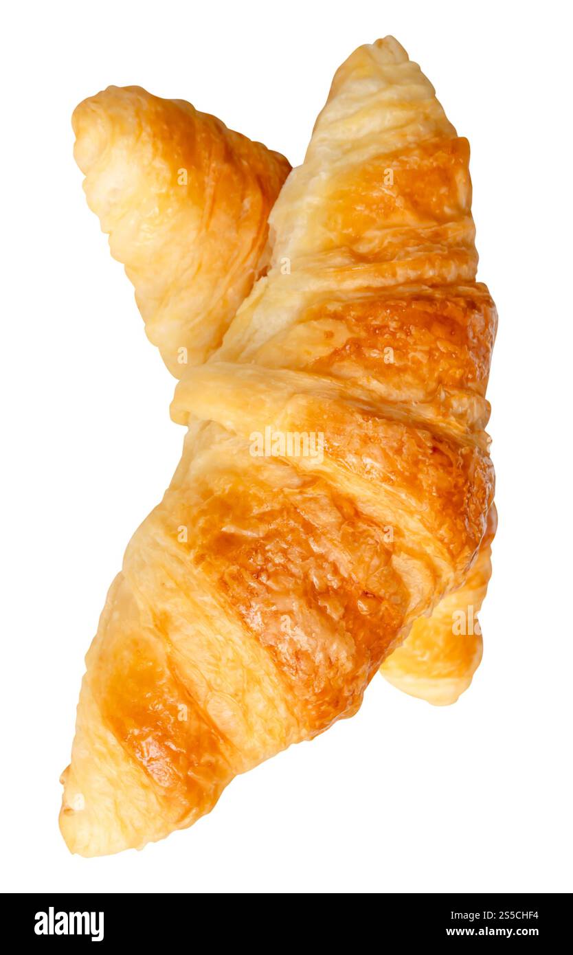 Top view of two brown or golden croissants in cross shape in stack is ...