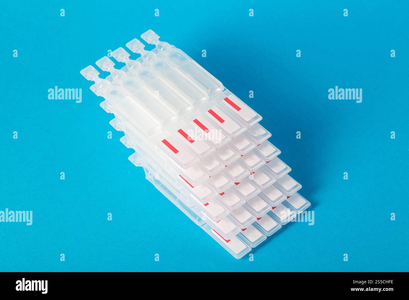 Tubes with medicine on a blue background. Concept of a laxative for the ...