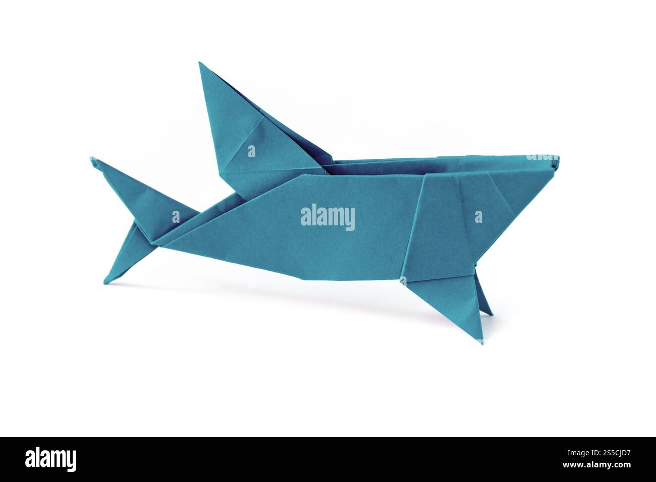 Blue paper shark origami isolated on a blank white background. Blue ...