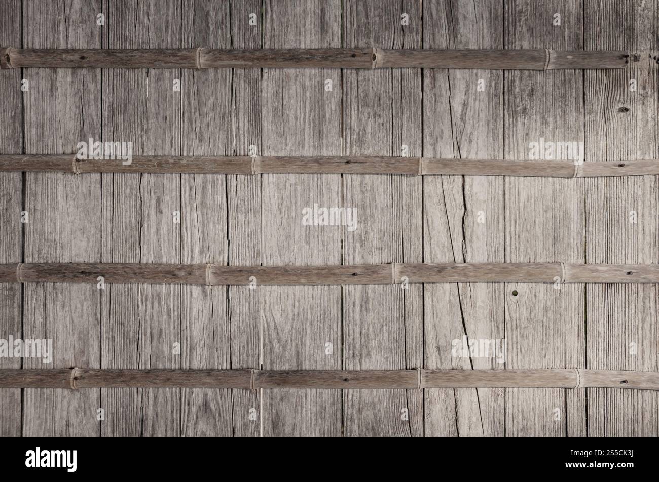 Bamboo wood wall illuminated by a ray of light, zen background texture ...