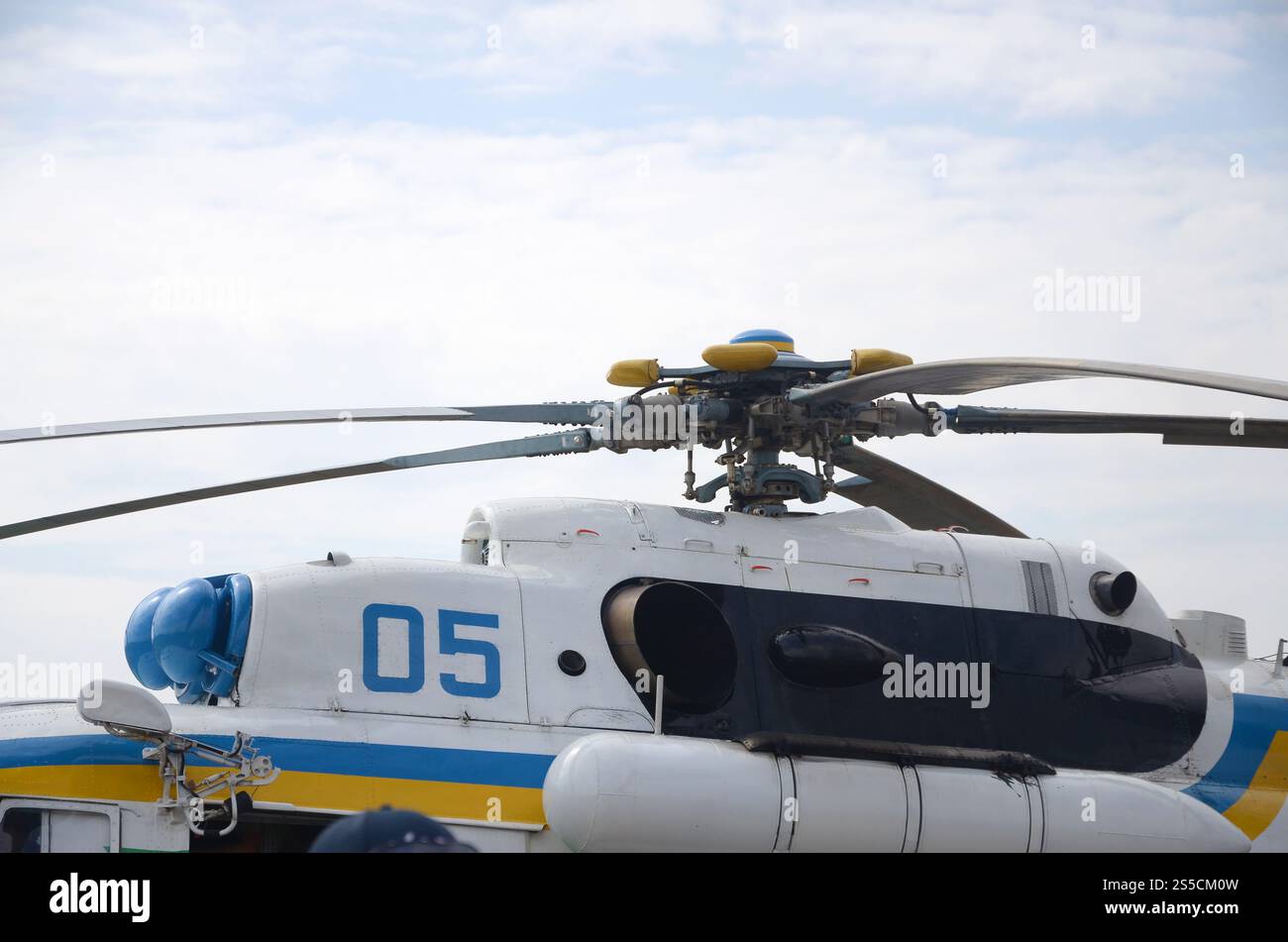 Fragment of helicopter screw engine close up against blue sky. The ...