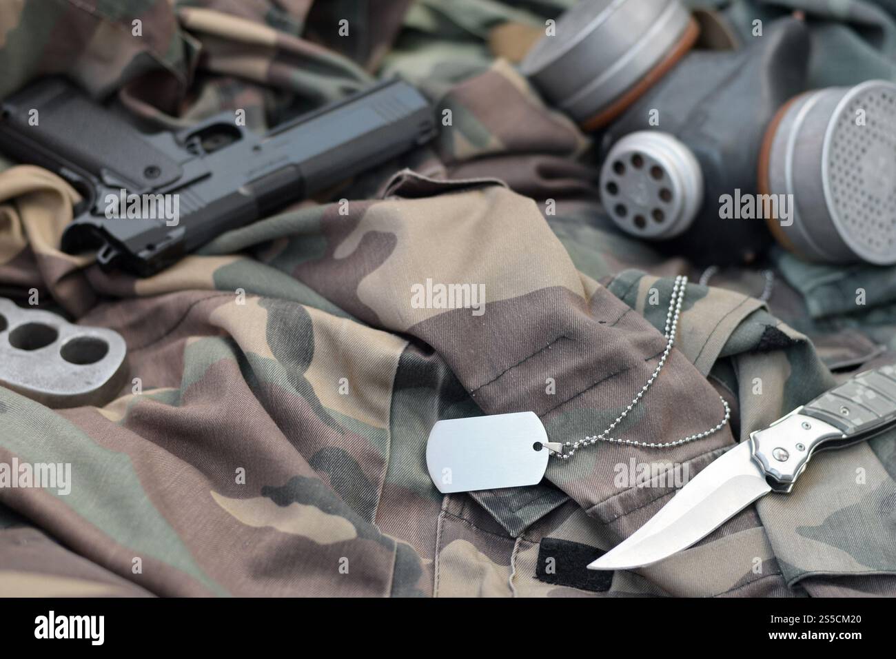 Stalker soldiers soviet gas mask lies with handgun and knife on green ...
