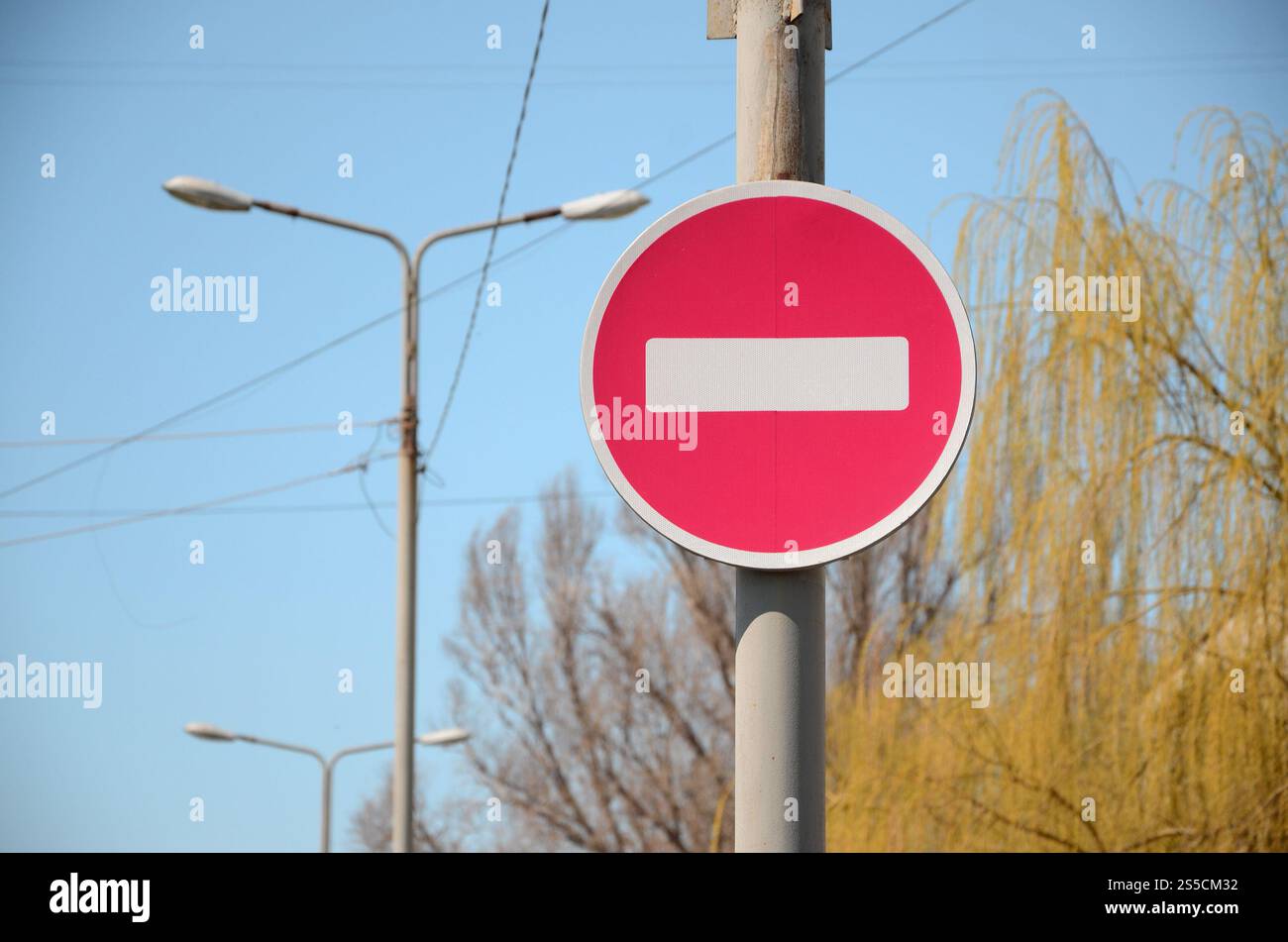 Road sign in the form of a white rectangle in a red circle. No entry ...