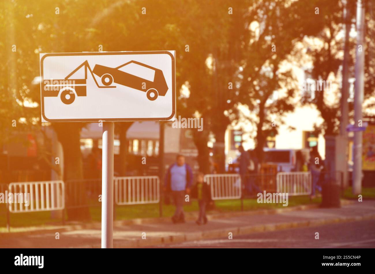 A road sign that shows a car tow truck, which raises a passenger car on ...