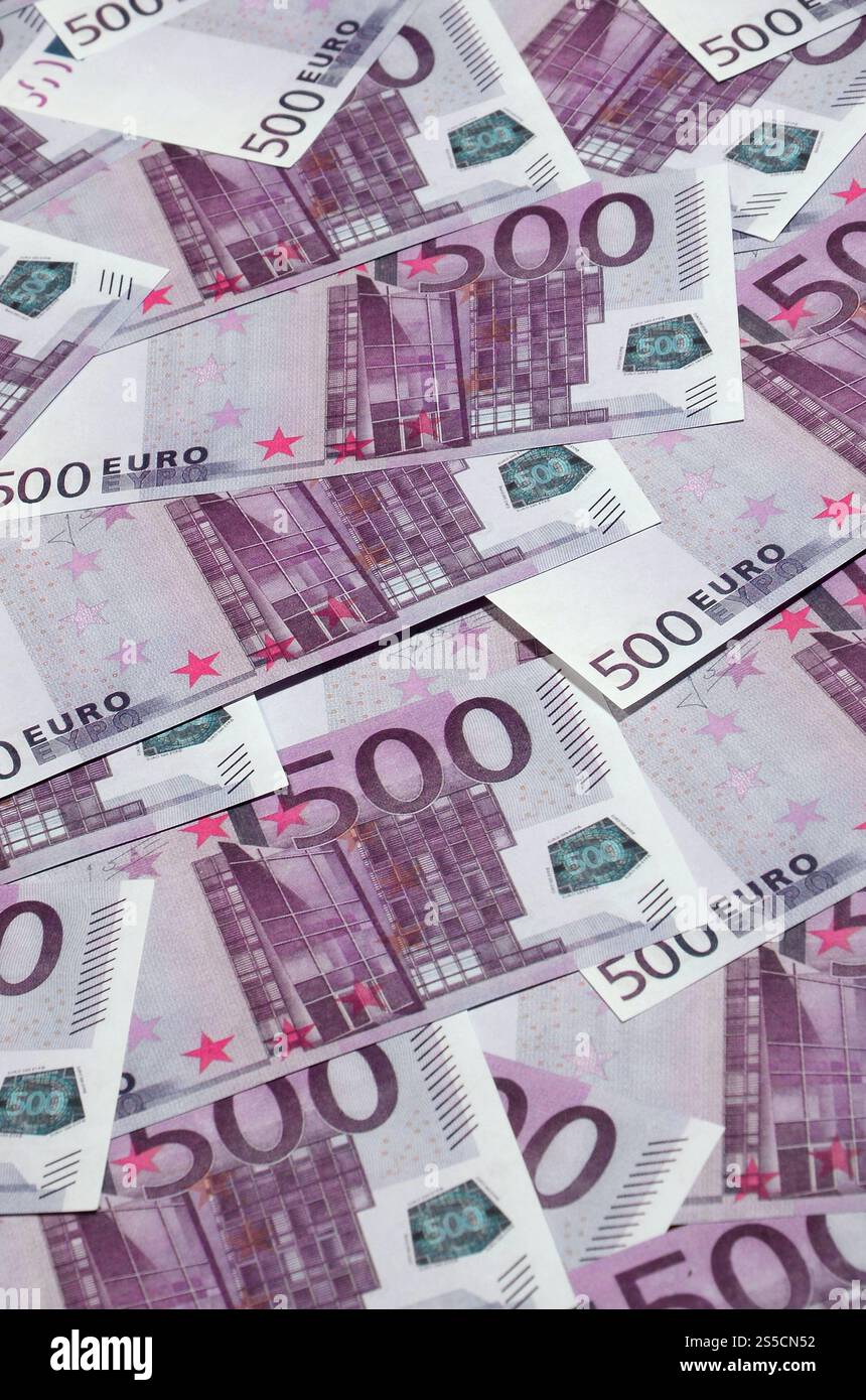 Money background consisting of purple five hundred Euro bills spread ...