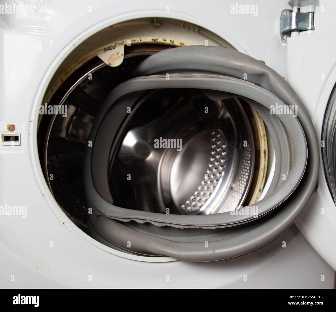 An old torn rubber seal for the sunroof with a defect, in the washing ...