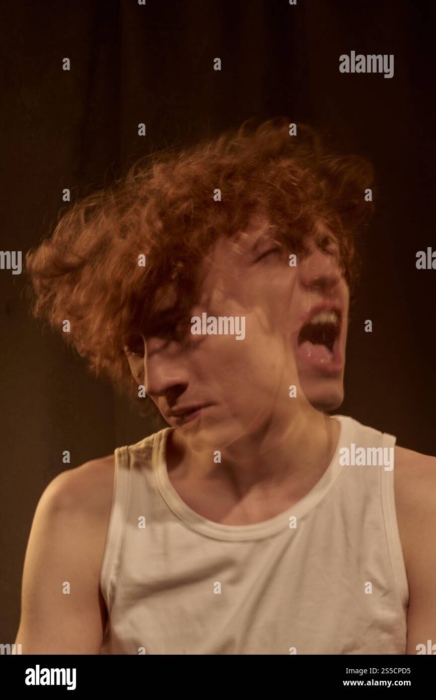 Vertical shot of sad man sitting still while having depressed ...