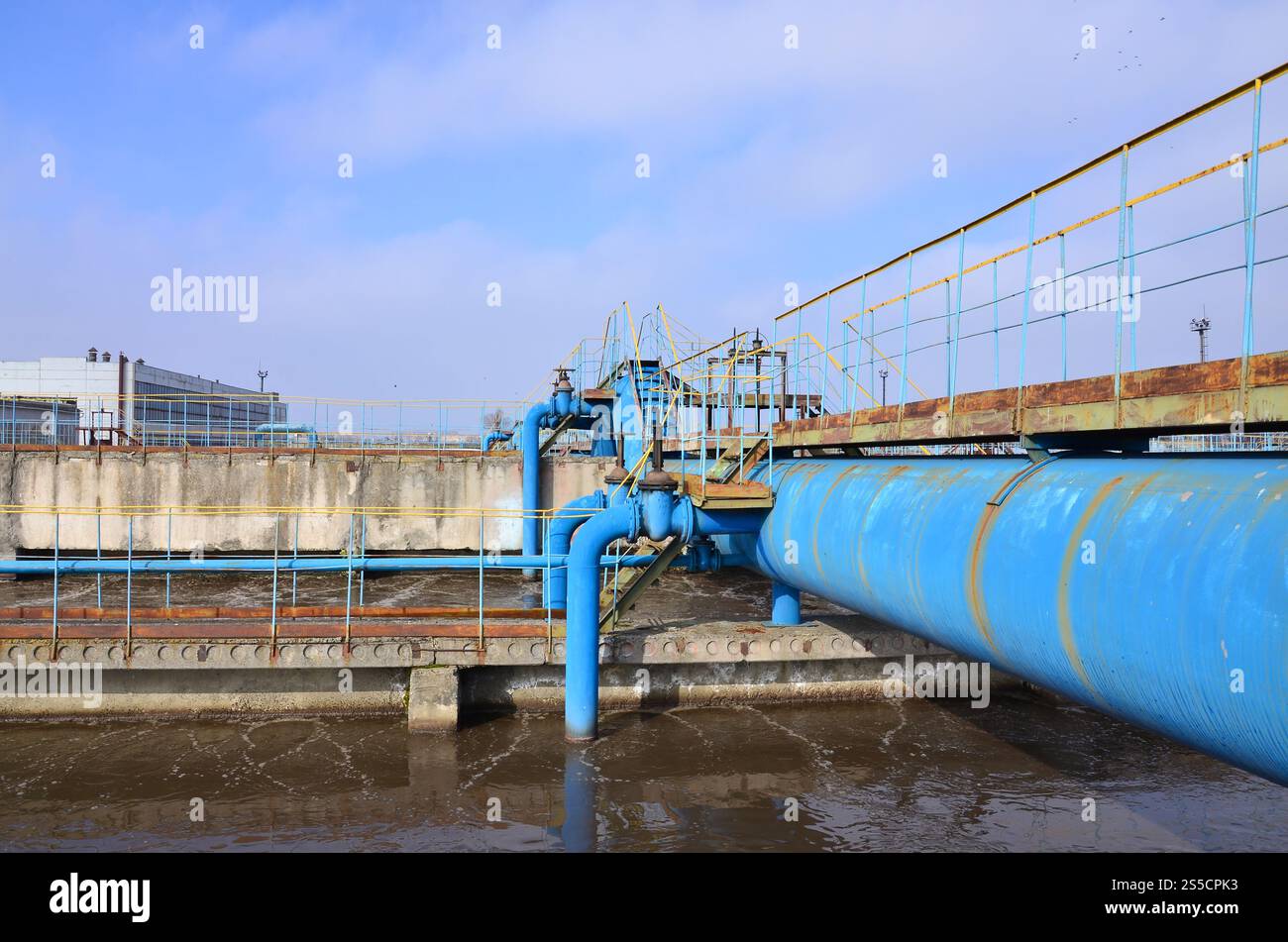 Industrial space with lots of pipes and communications on a background ...