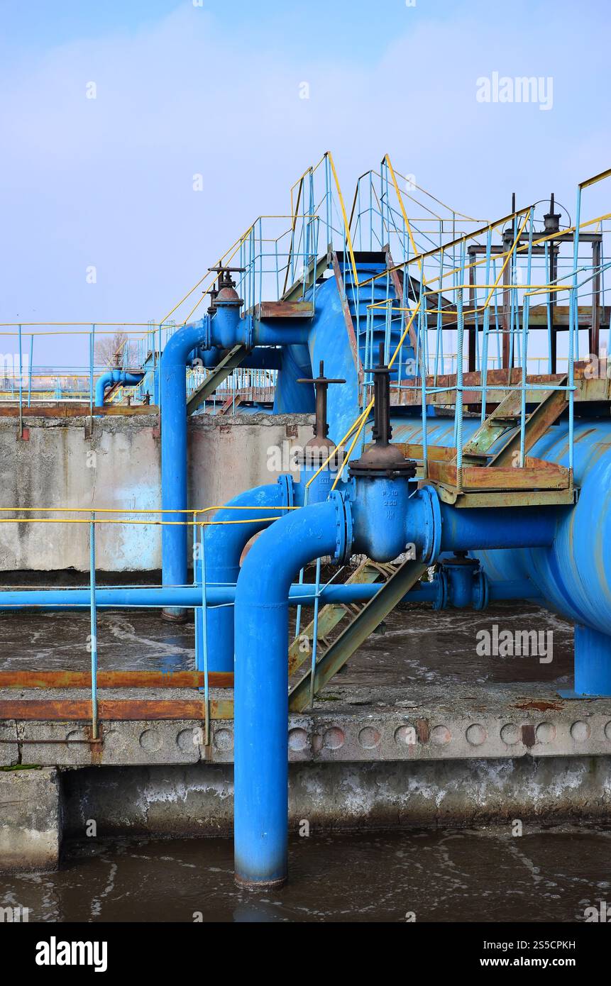 Industrial space with lots of pipes and communications on a background ...