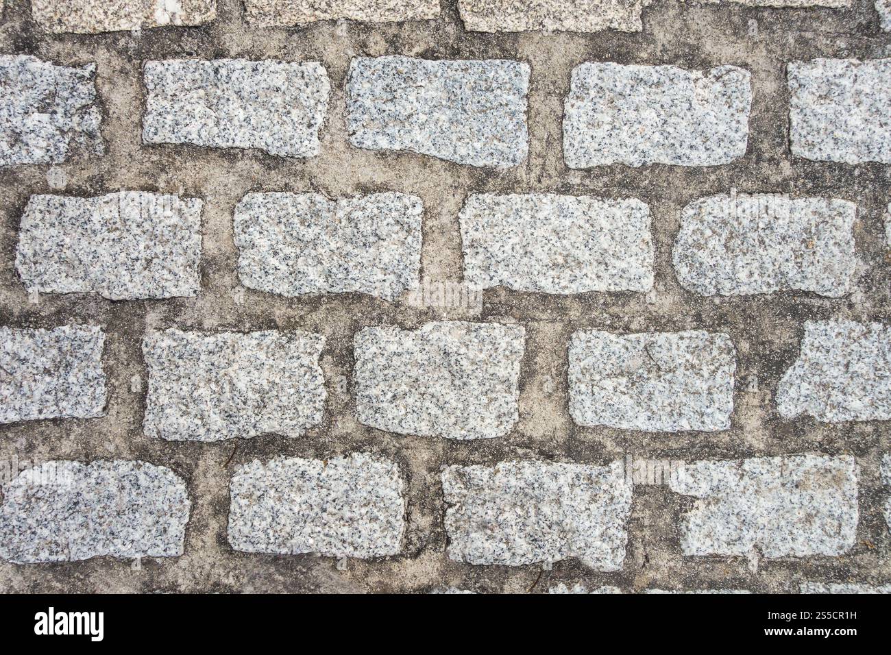Old cobblestone pavement background texture. Closeup view. Old cobblestone pavement background ...