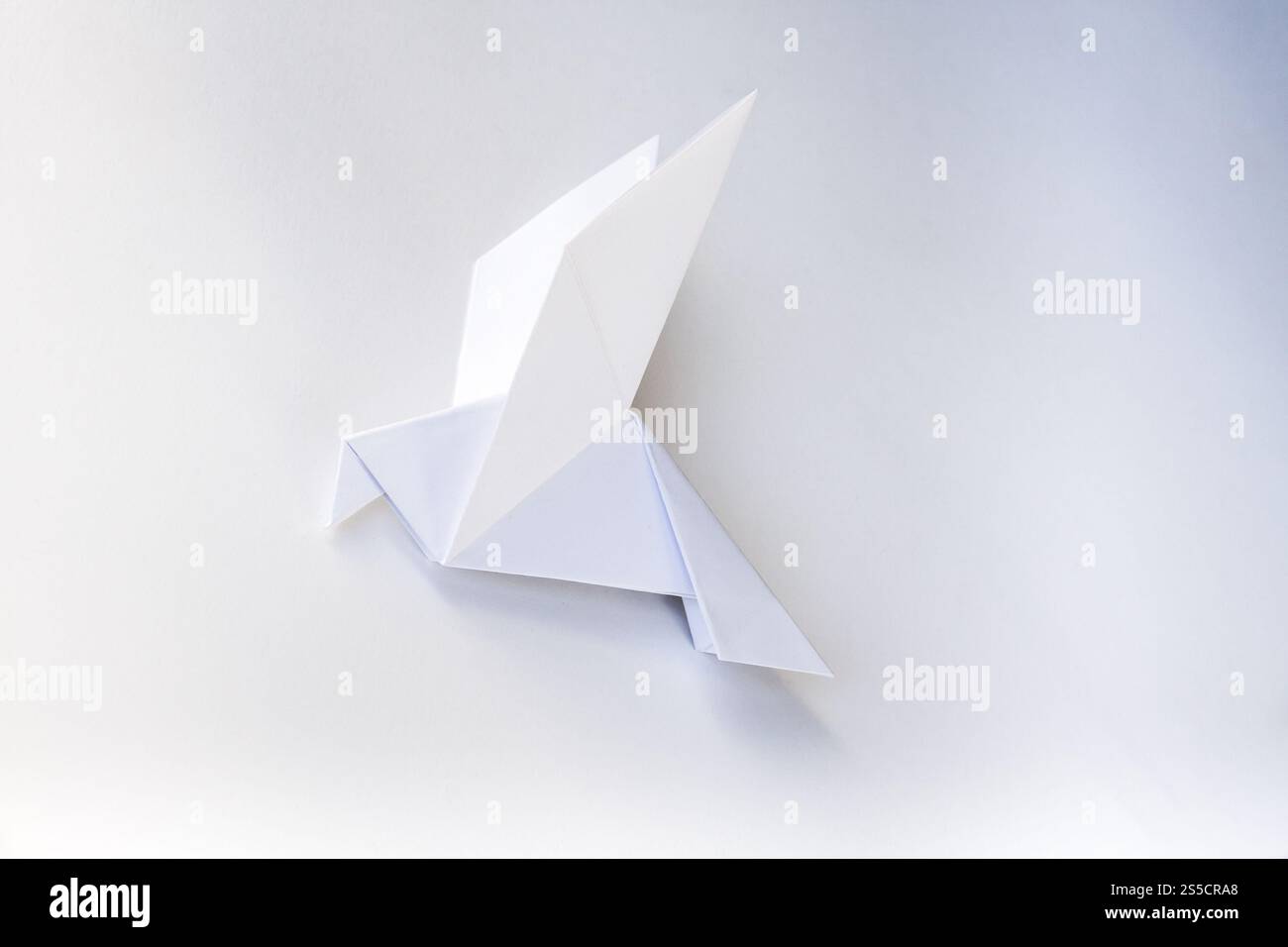 Paper dove origami isolated on a blank white background Stock Photo - Alamy