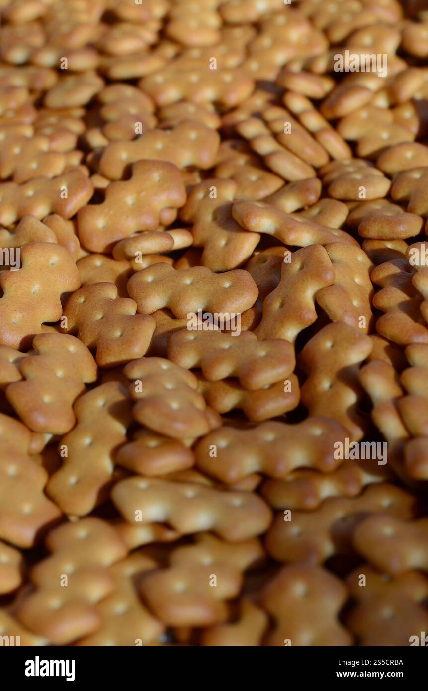 A huge bunch of salted biscuits of small sizes as a closed pattern or ...