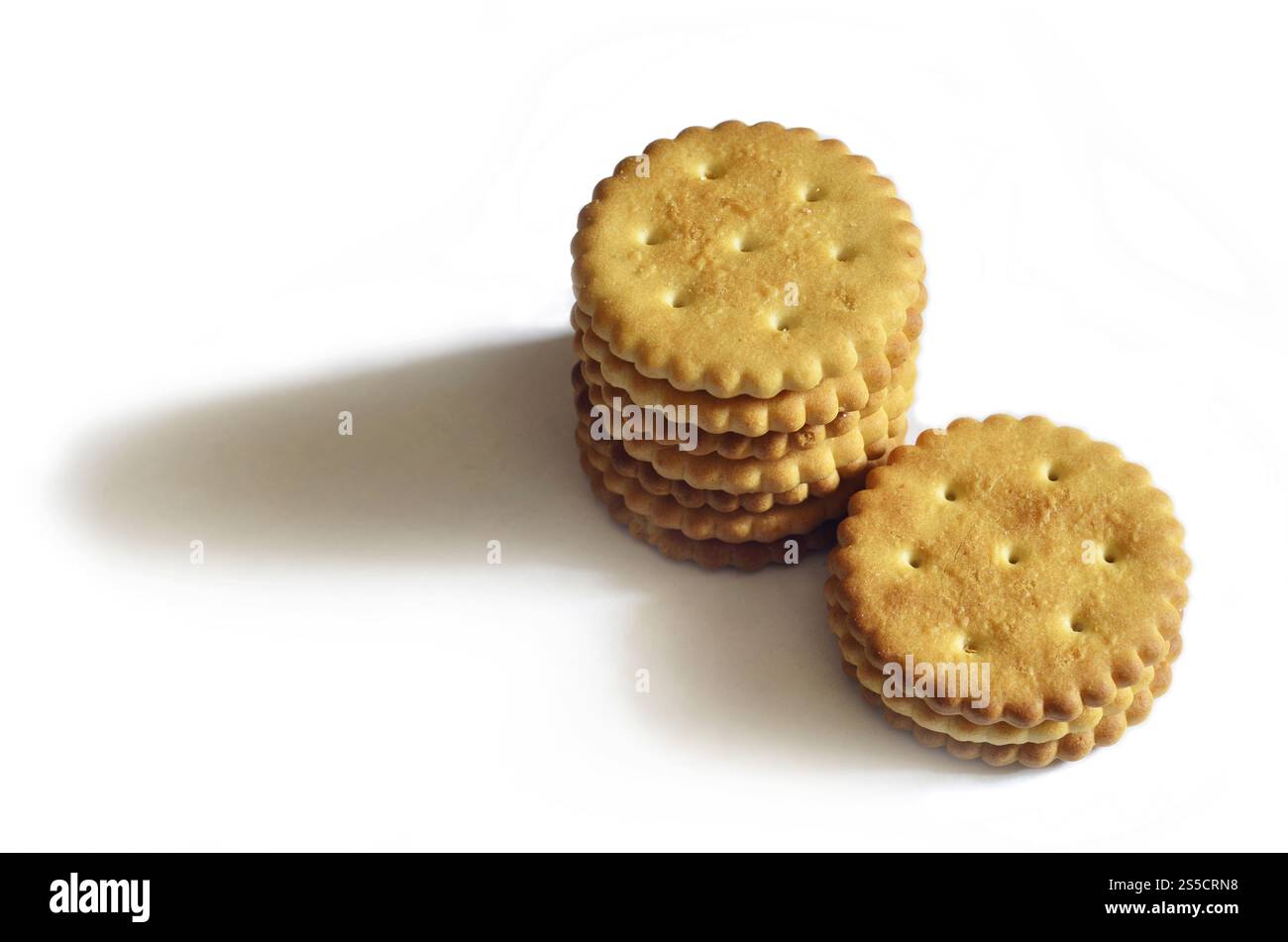 Classic round golden yellow salted cracker isolated on over white ...
