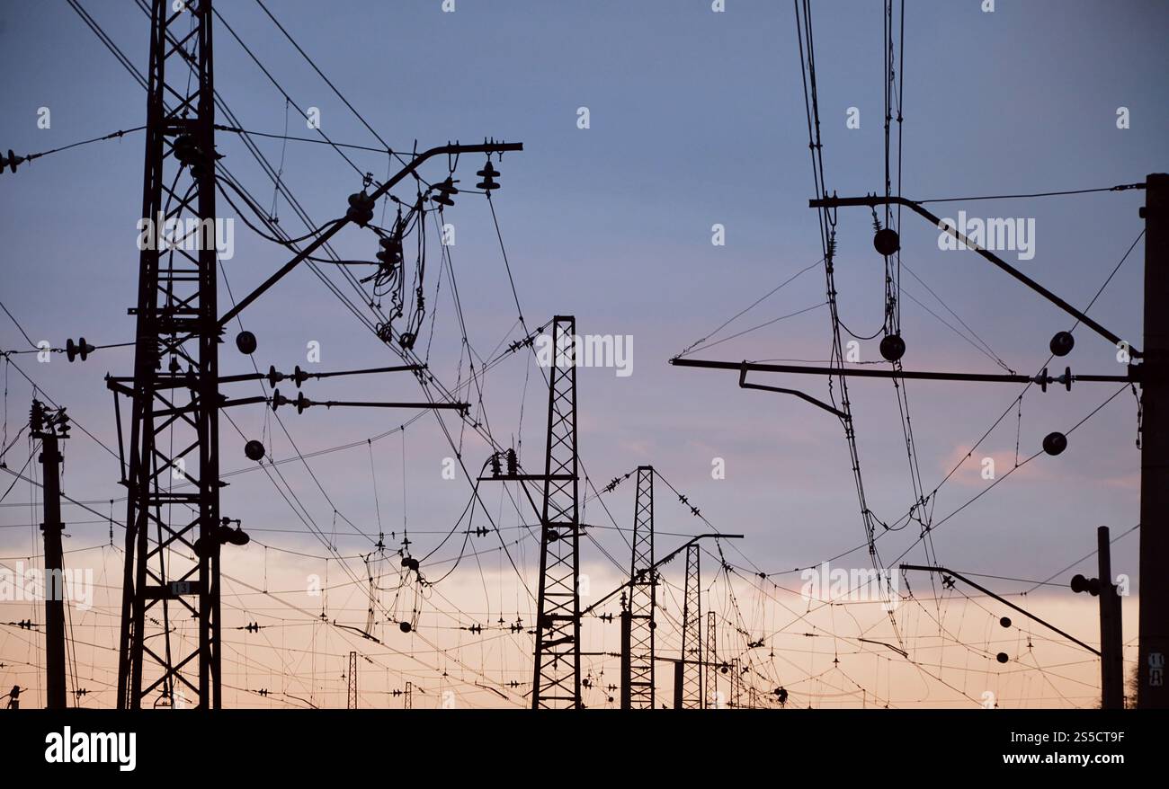 Railroad overhead lines against clear blue sky, Contact wire. High ...
