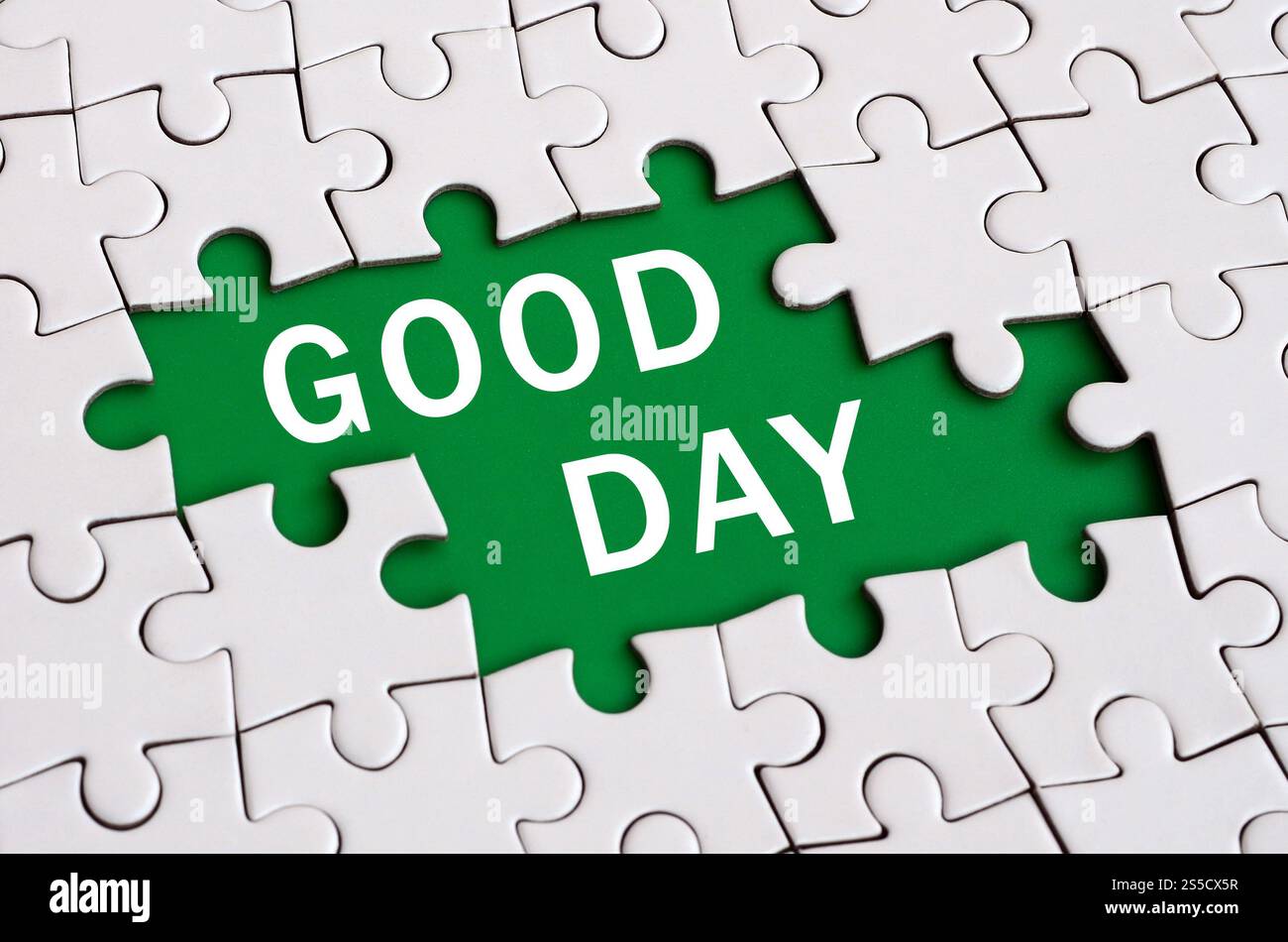 White jigsaw puzzle in assembled state with missing elements forming a ...