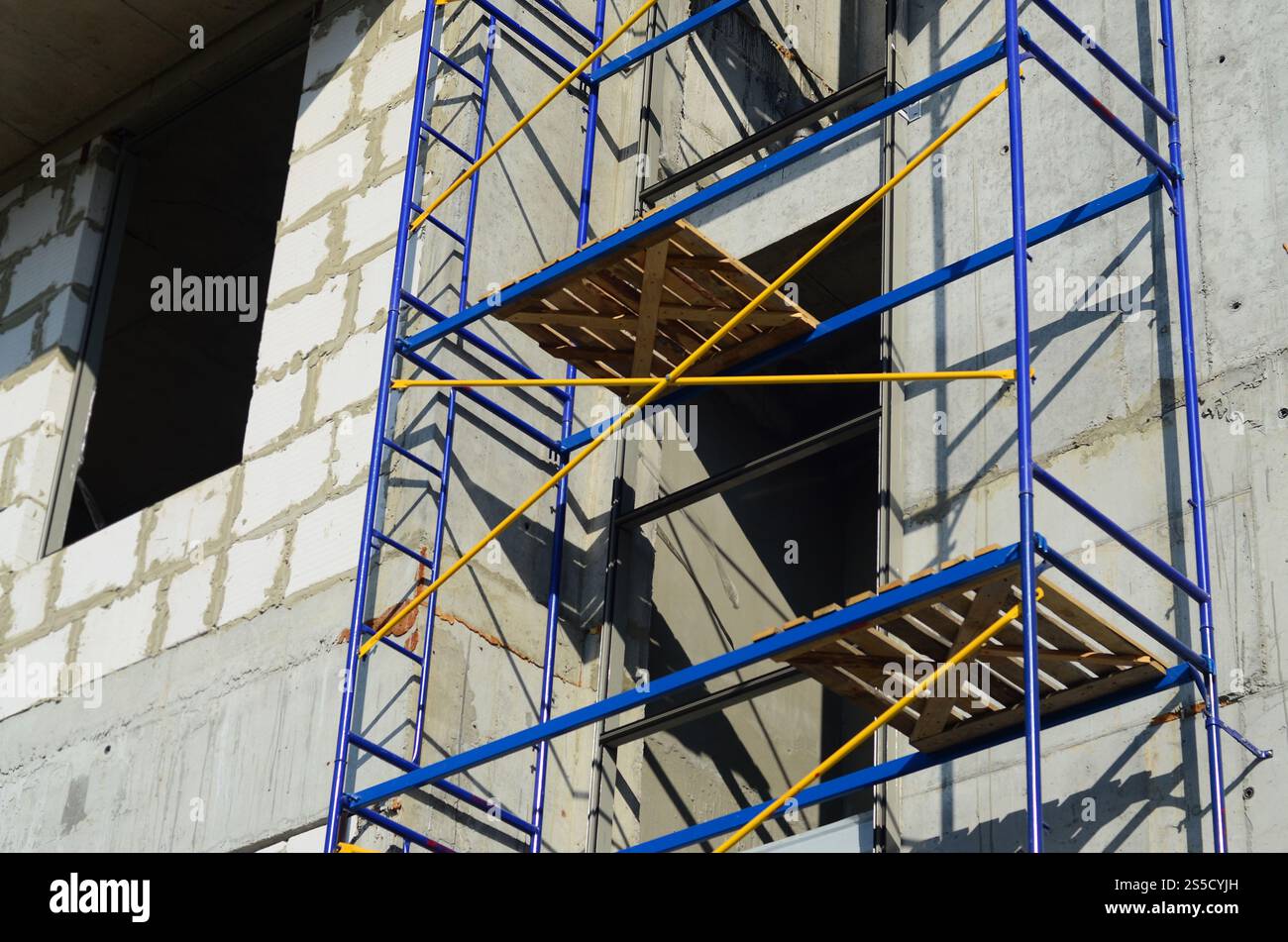 Blue and yellow construction scaffolding of a Russian building under ...