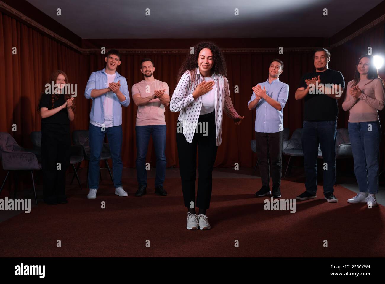 Professional actors bowing on stage in theatre Stock Photo - Alamy