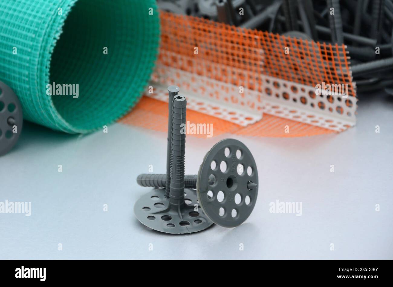 A set of construction items for the insulation of walls. Plastic dowels ...