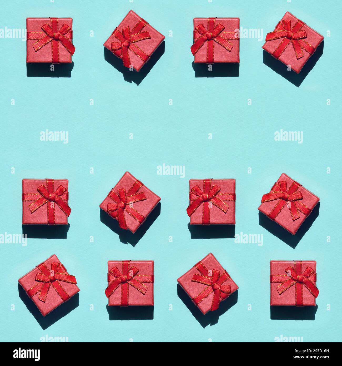 Many small red pink gift boxes on texture background of fashion trendy ...