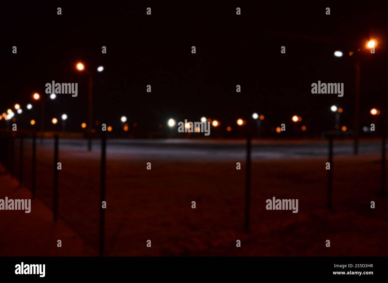 Blurred photo of school playground at night with bright lights Stock ...