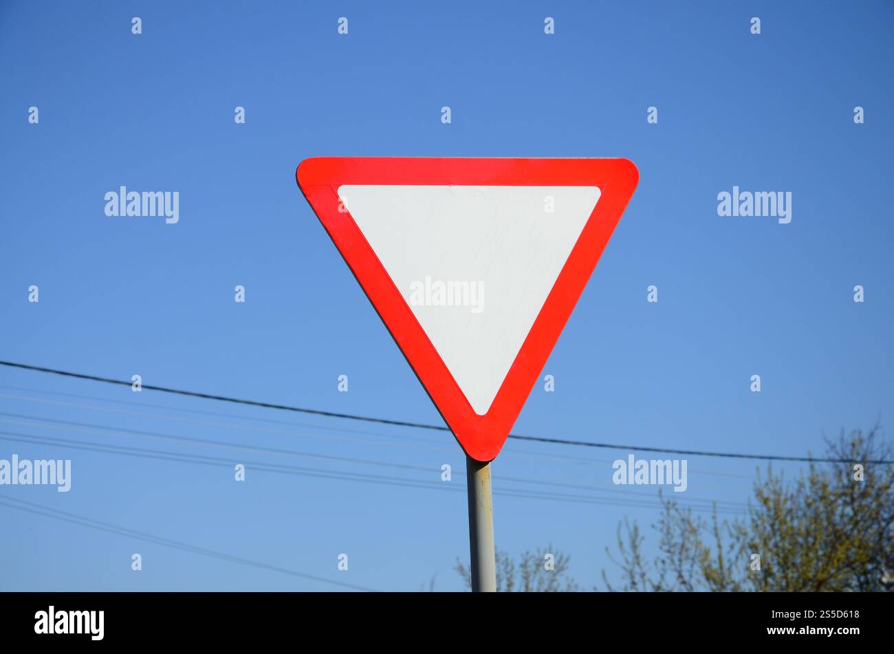 Traffic sign in the form of a white triangle. Give way Stock Photo - Alamy