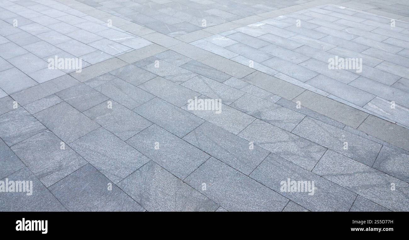 Fragment of the square paved of a large granite tiles Stock Photo - Alamy