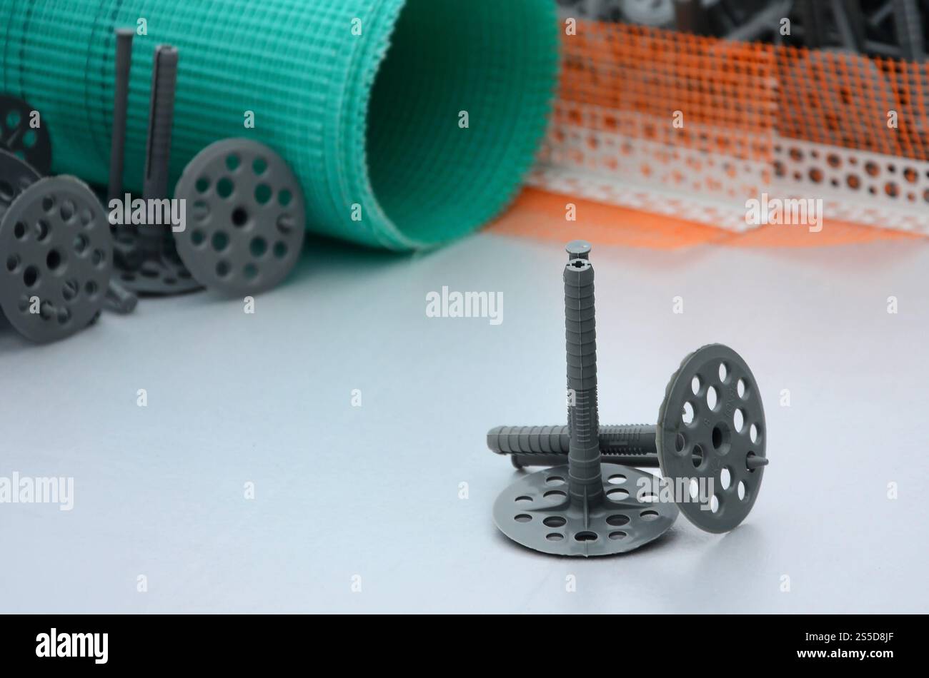 A set of construction items for the insulation of walls. Plastic dowels ...