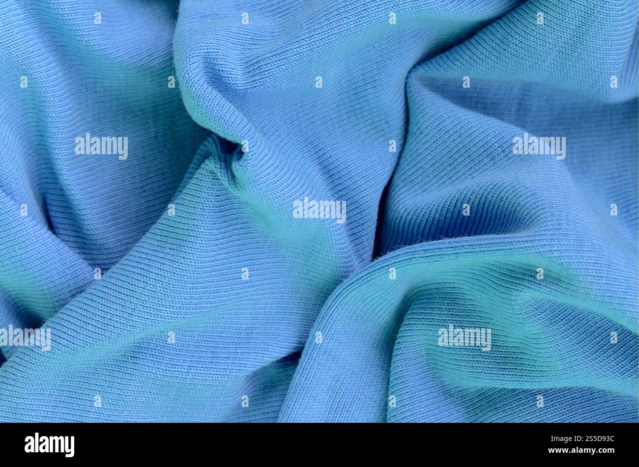 The texture of the fabric in blue color. Material for making shirts and ...