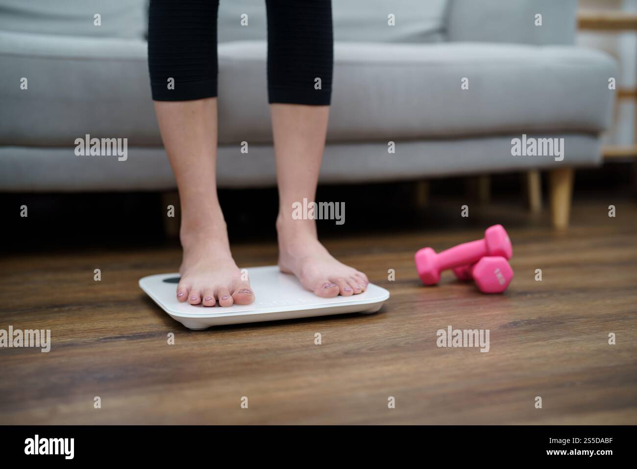 Fat diet and scale feet standing on electronic scales for weight ...