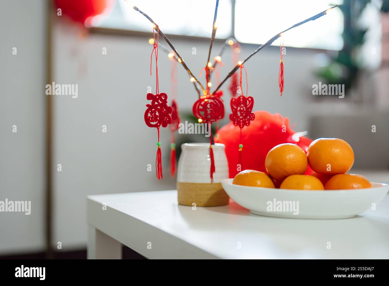 Decorated flat putting traditional pendant to the red Chinese New Year ...
