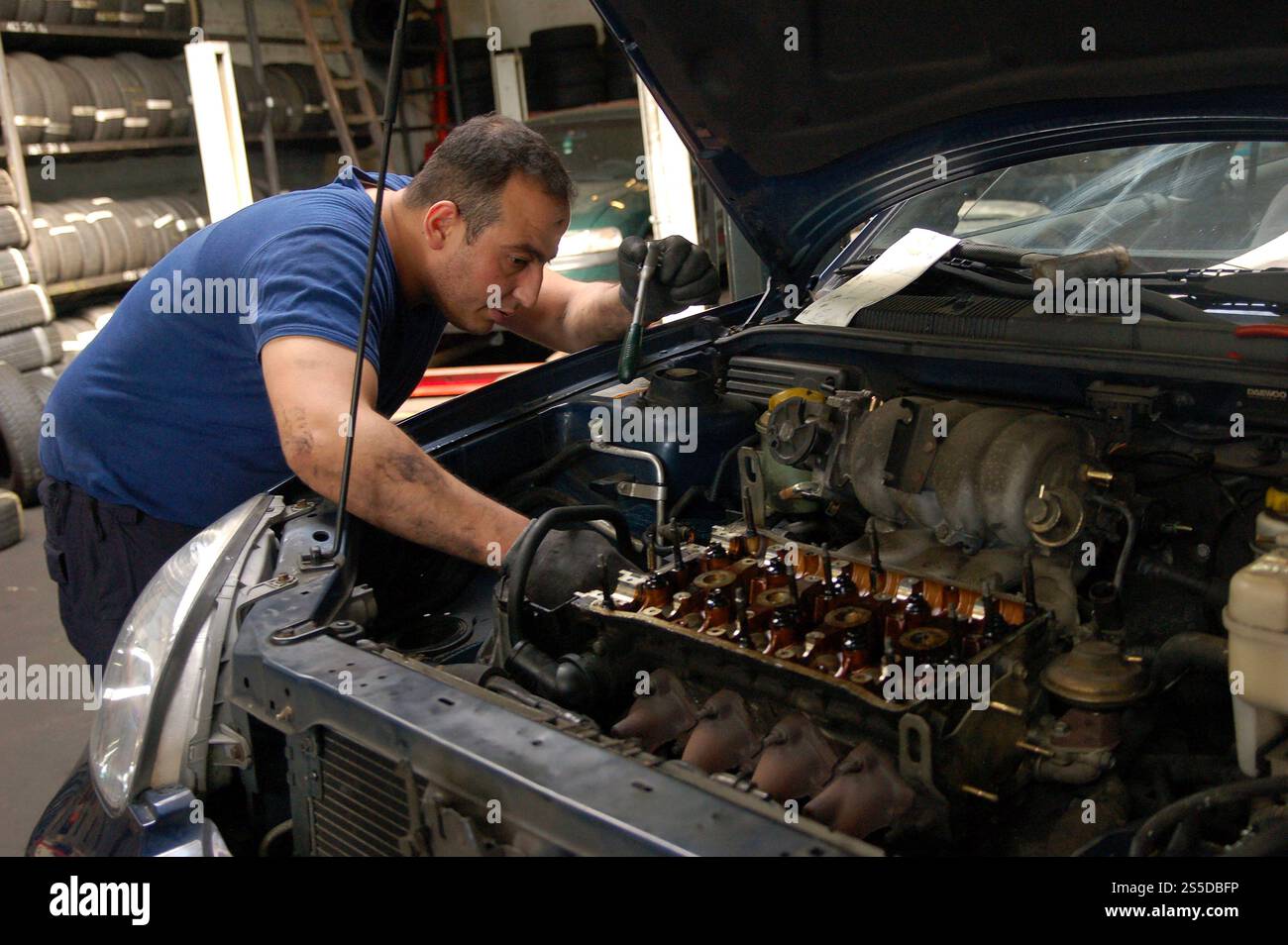 Turkish Car Mechanic Hard at Work. An Immigrant, Turksih Car Mechanic ...