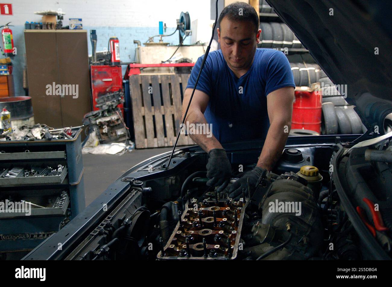 Turkish Car Mechanic Hard at Work. An Immigrant, Turksih Car Mechanic ...
