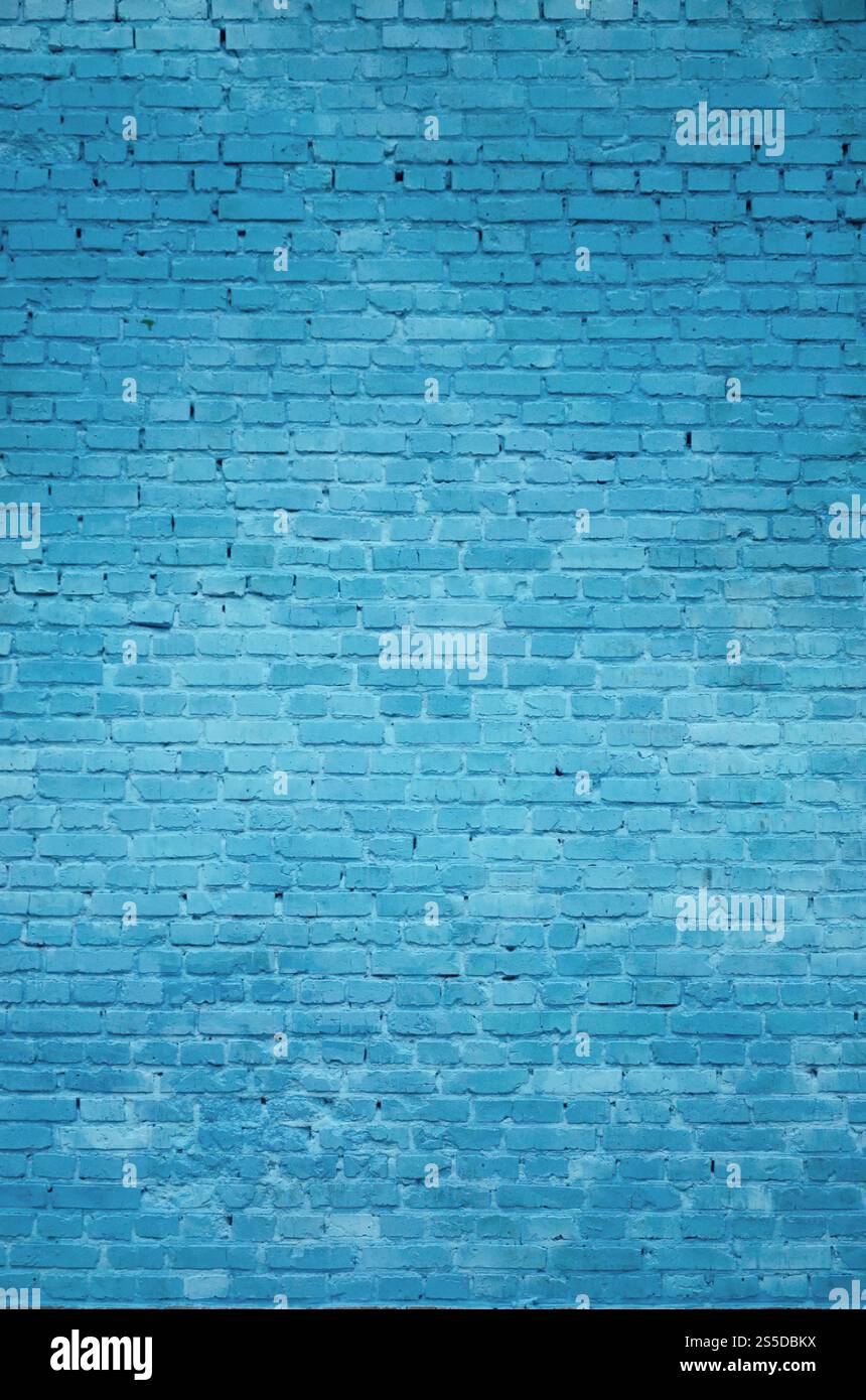 The texture of the brick wall of many rows of bricks painted in blue ...