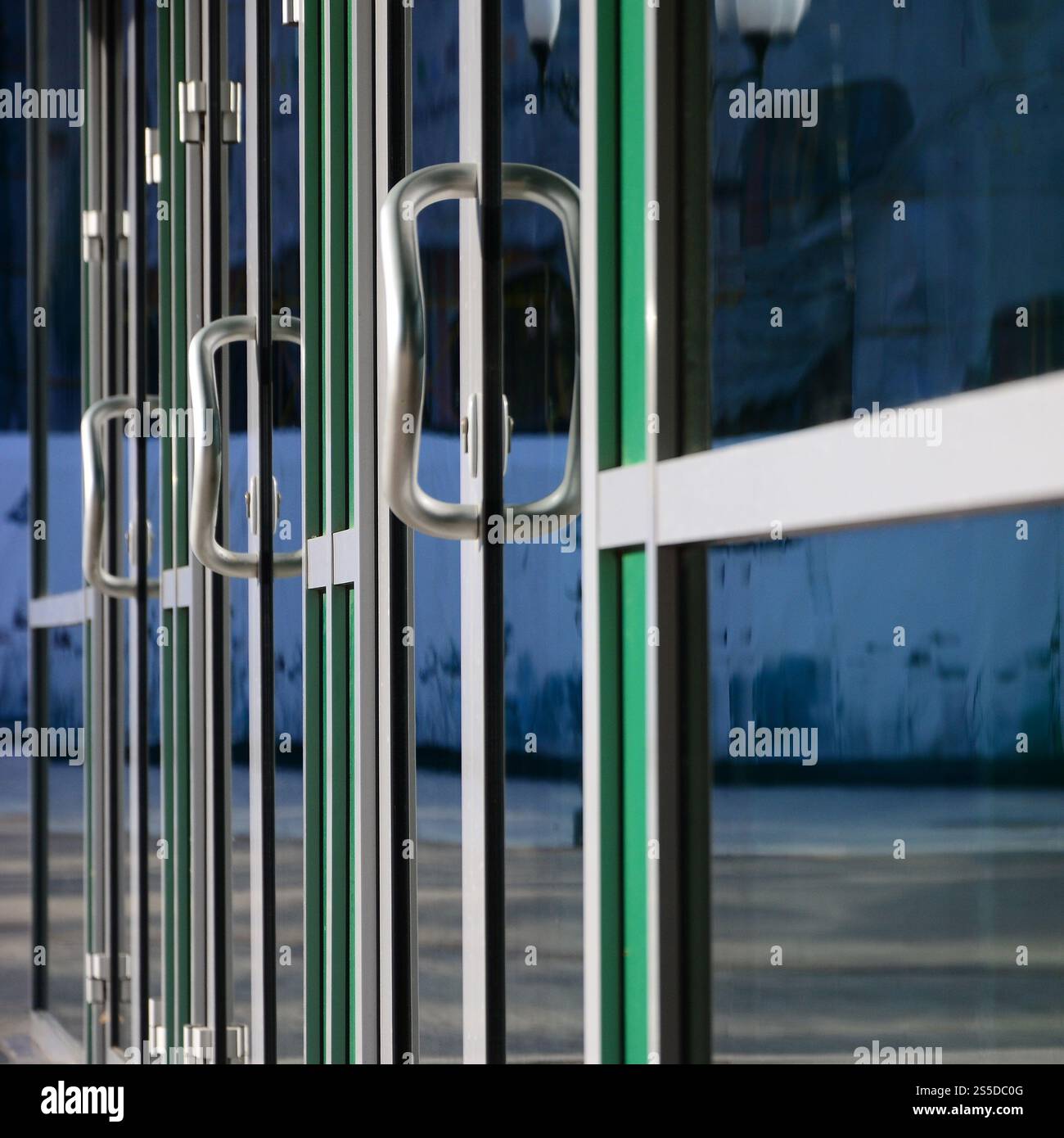 Chrome door handle and glass of modern aluminium door outside the ...