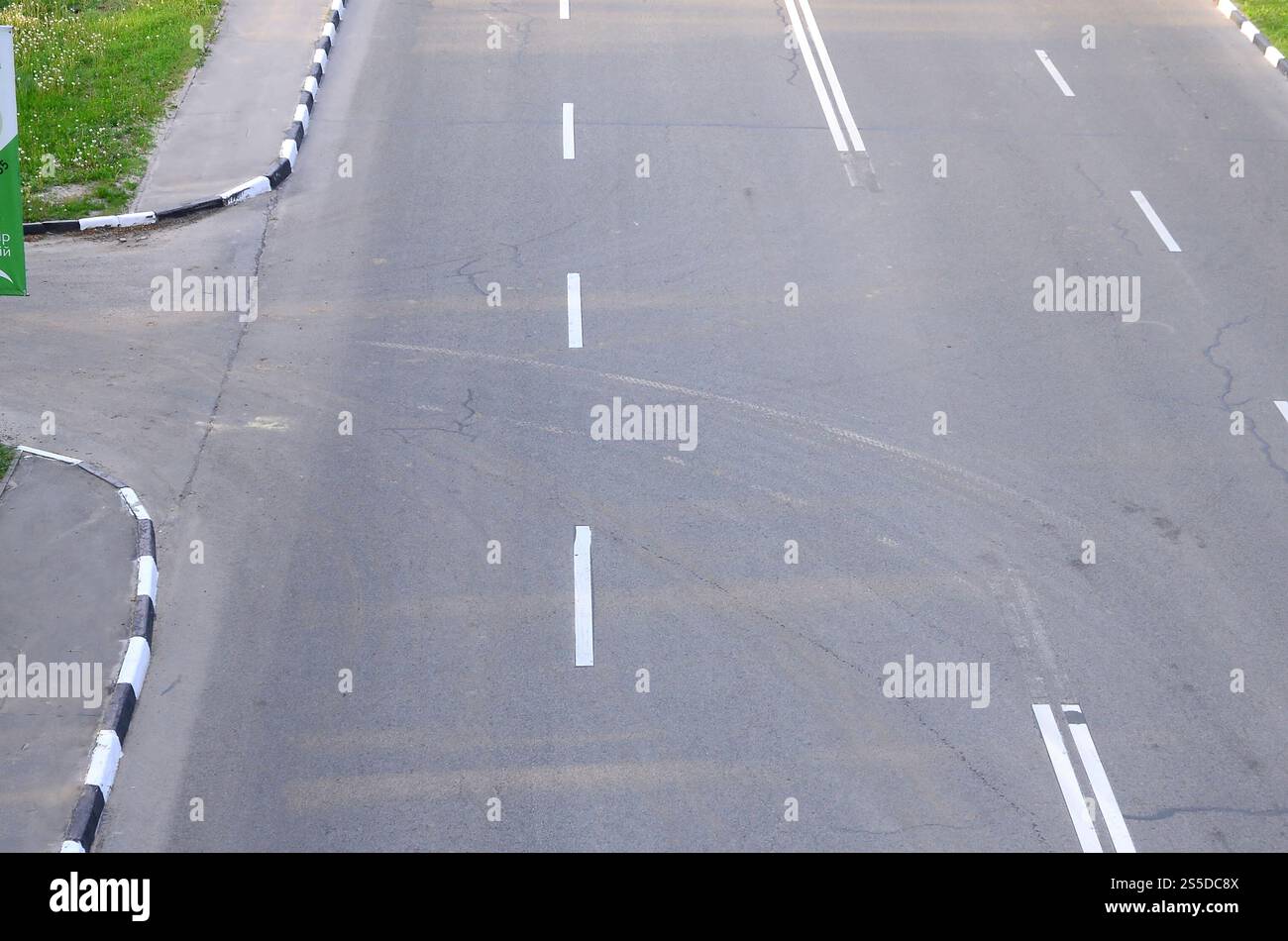 Damaged bad asphalt road with potholes. Patch repair of asphalt. Bad ...