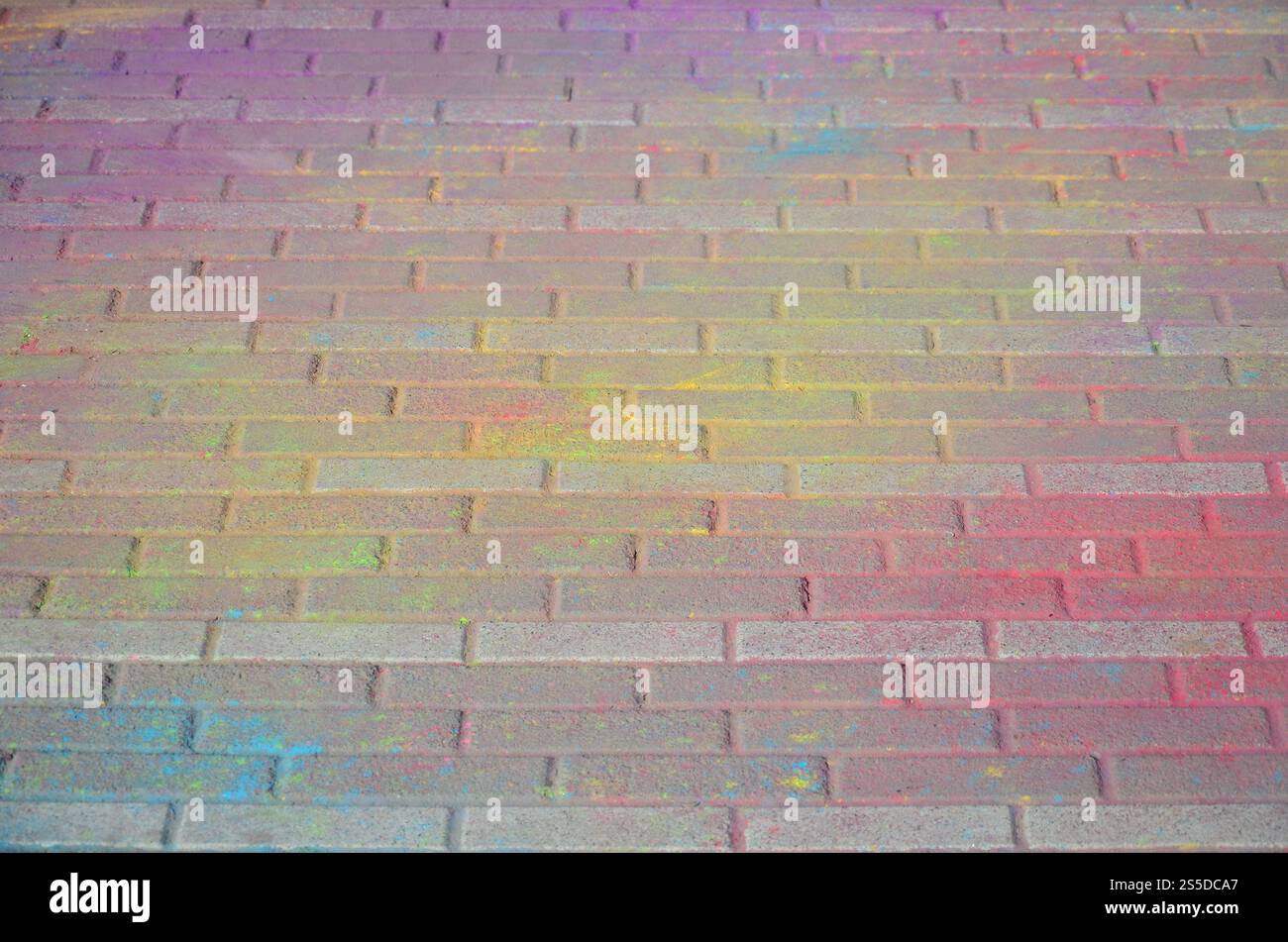 Multi colored earth, paving slabs, powder coated with dry colors at the ...